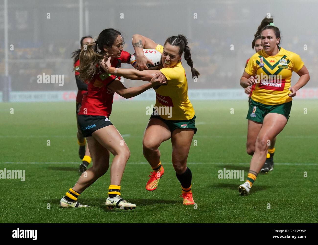Australia's Isabelle Kelly (right) holds off Papua New Guinea's Shae ...