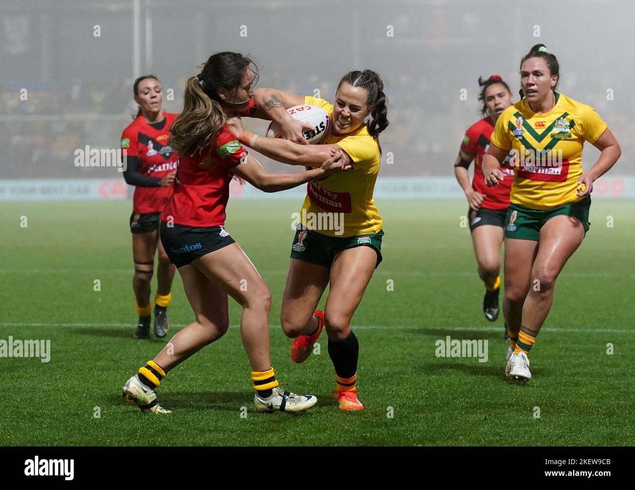 Australia's Isabelle Kelly (right) holds off Papua New Guinea's Shae ...