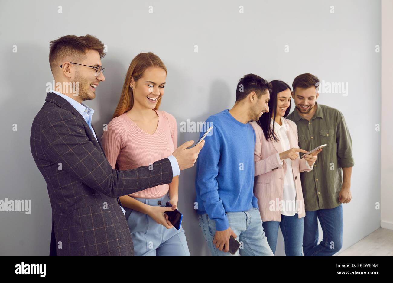 Young men discussing mobile application hi-res stock photography and ...