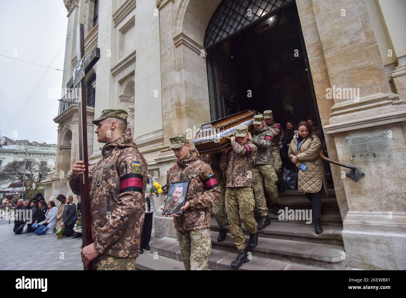 Soldiers carry coffins with the bodies of the defenders of Ukraine, who ...