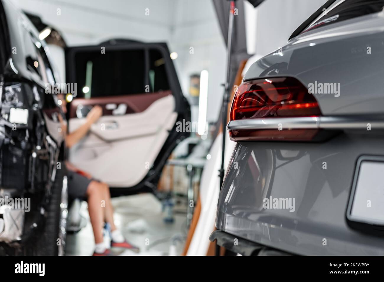 Car wrapping process, close up of man putting interior car protective ...
