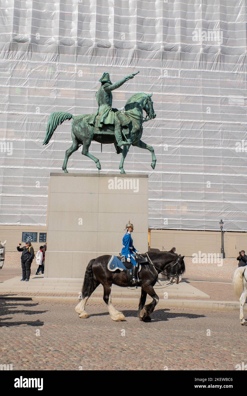 Royal Guards on horseback ride past Charles XIV John's statue (Karl XIV ...