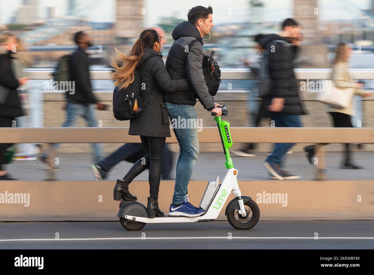 A couple riding on a Lime e-scooter part of the Transport for London e ...