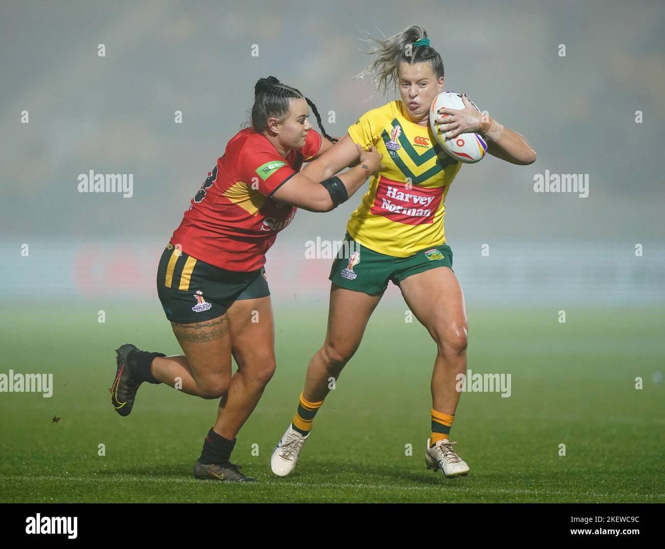 Australia's Lauren Brown (right) holds off Papua New Guinea's Jessikah ...