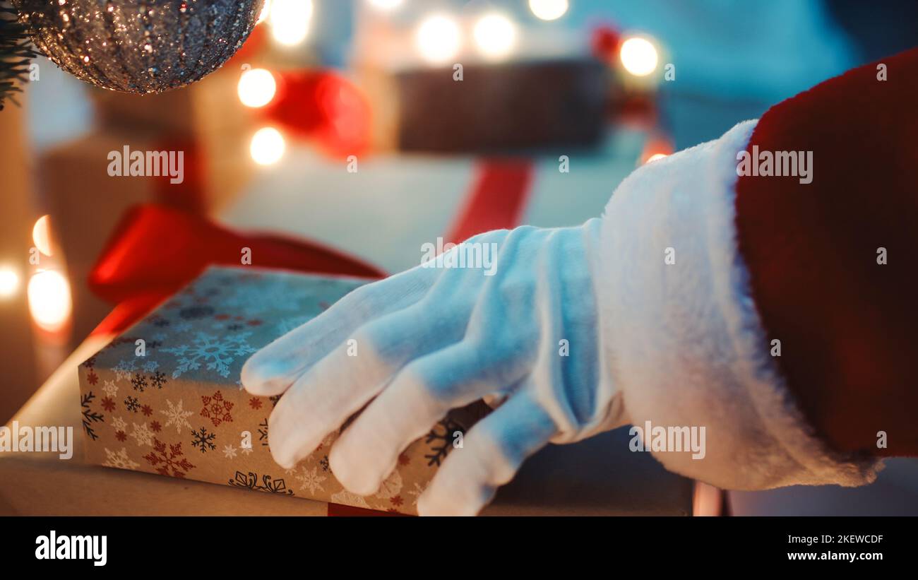 Santa claus poses gifts under hi-res stock photography and images - Alamy