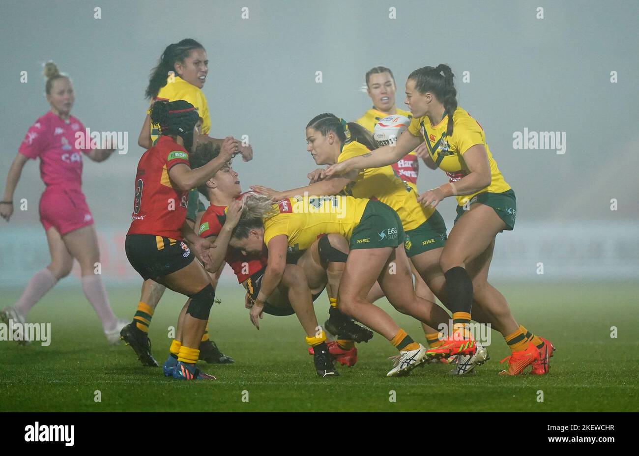 Papua New Guinea's Shellie Long is tackled by Australia's Lauren Brown ...