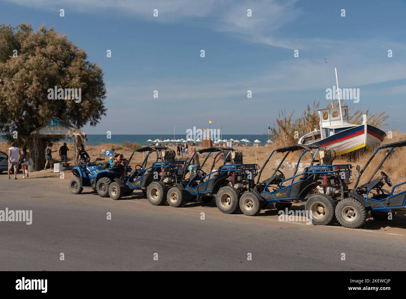 Crete, Greece,Europe. @2022. Twin seat quad bikes and passengers take a ...