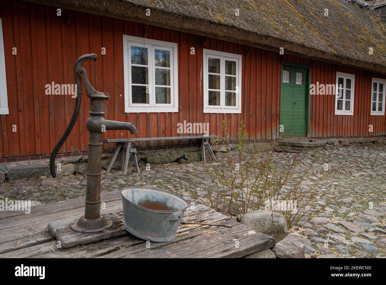 Hand pump water well on a traditional old Swedish farm at Skansen ...
