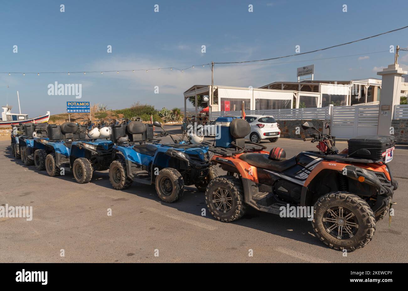 Crete, Greece,Europe. @2022. Twin seat quad bikes and passengers take a ...
