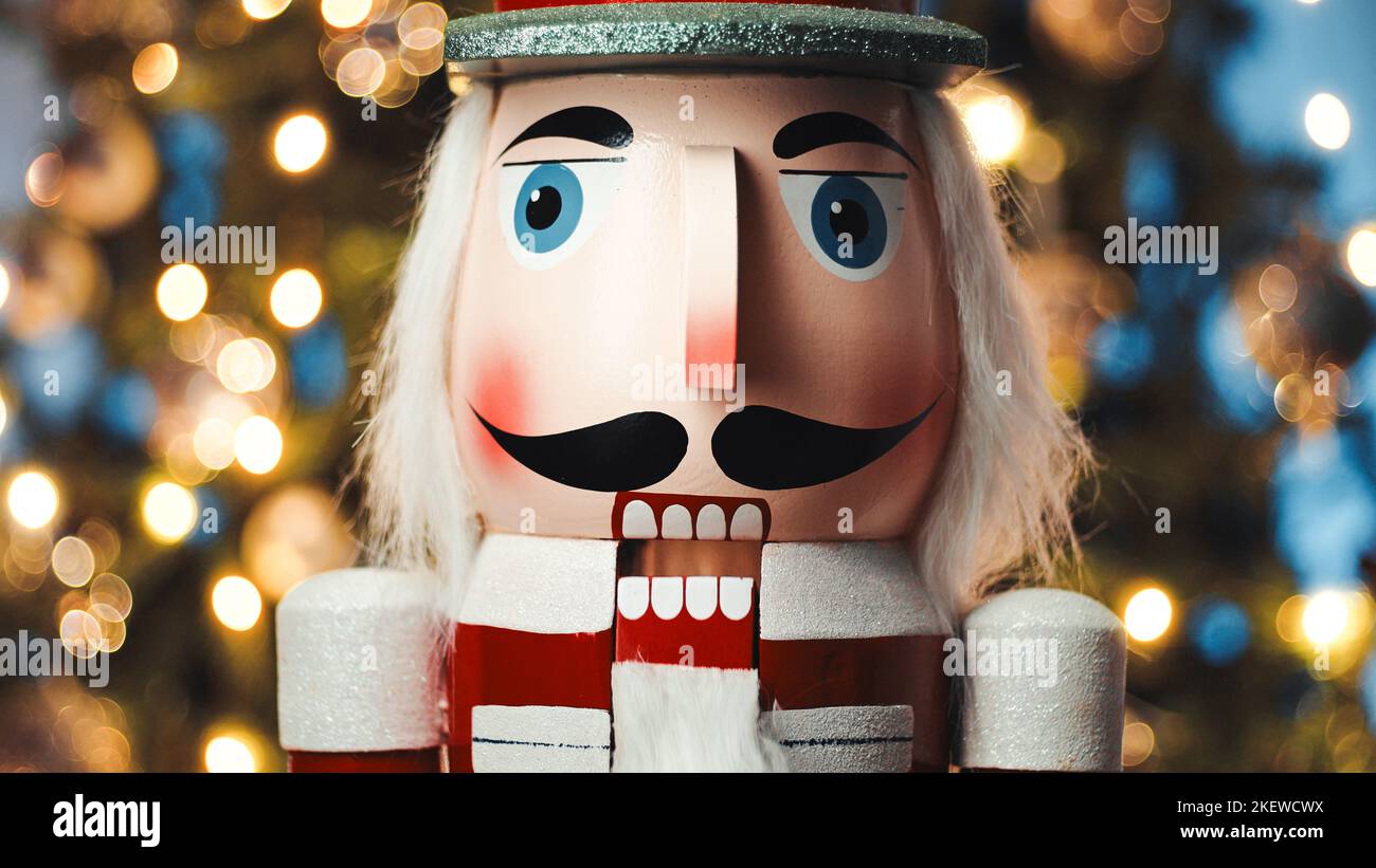 Christmas Nutcracker In Front Of Christmas Tree Stock Photo - Alamy