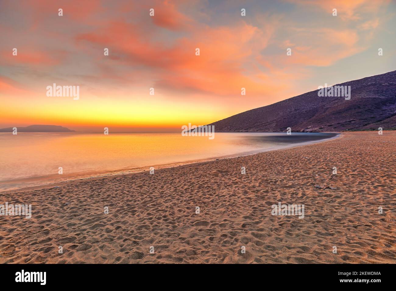 The sunrise from the sandy beach Agia Theodoti in Ios island, Greece ...
