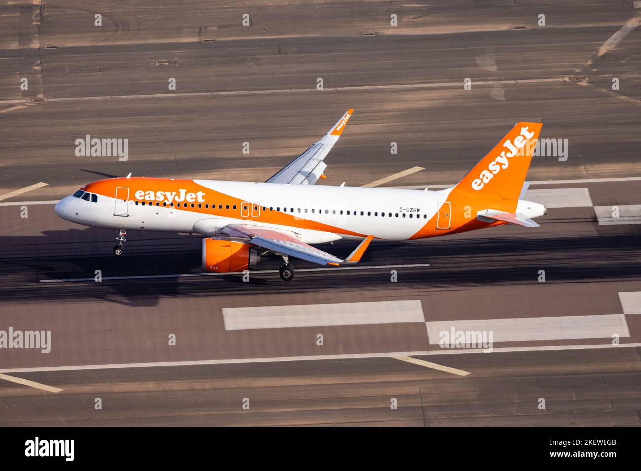 EasyJet Airplane landing to the airport during sunny morning. Aerial ...