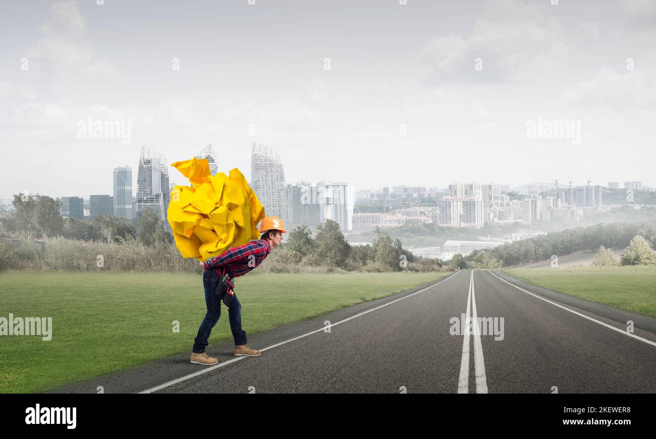 Engineer man carry load Stock Photo - Alamy