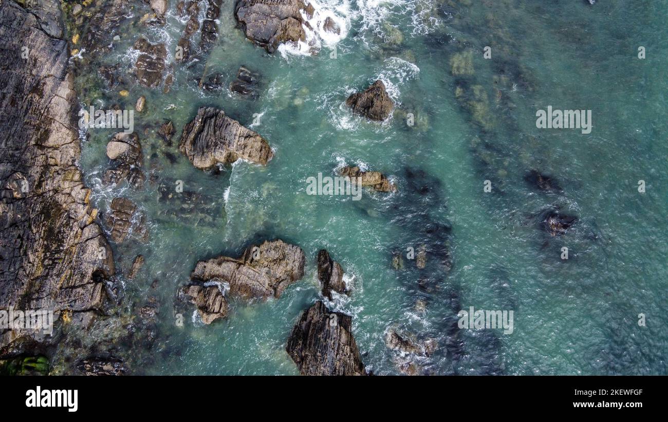 A lot of boulders in the sea. Coastal cliffs of the North Atlantic ...