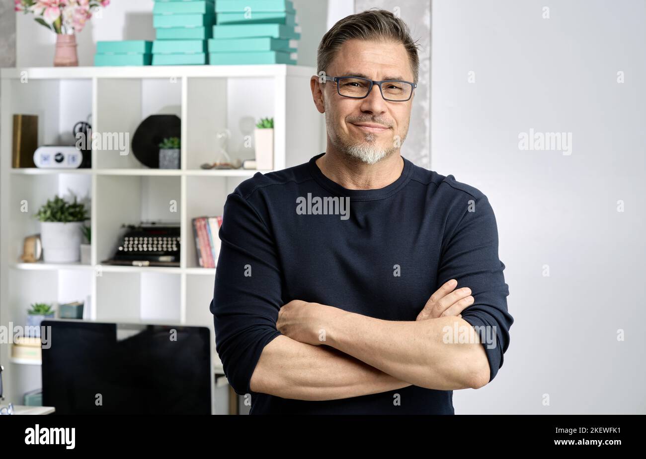 Happy older good looking casual man at home, smiling. Portrait of mid ...