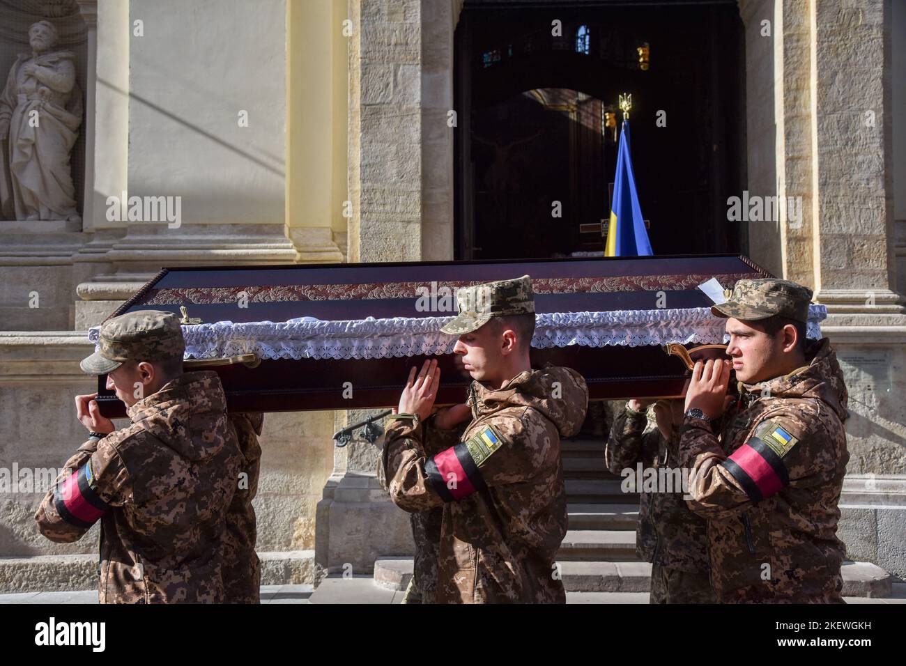 Lviv, Ukraine. 18th Oct, 2022. Soldiers carry coffins with the bodies ...
