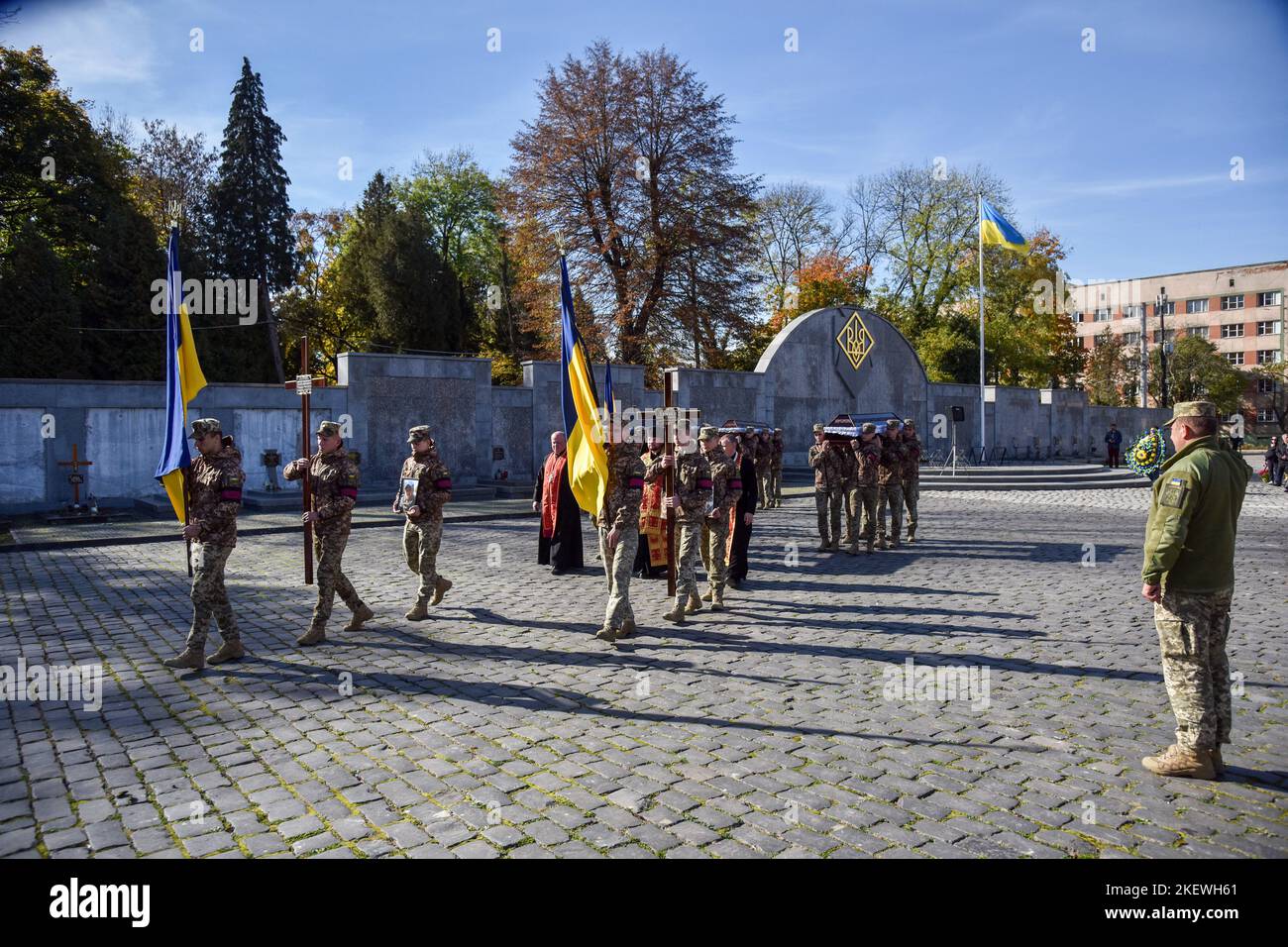 Lviv, Ukraine. 18th Oct, 2022. Soldiers carry coffins with the bodies ...