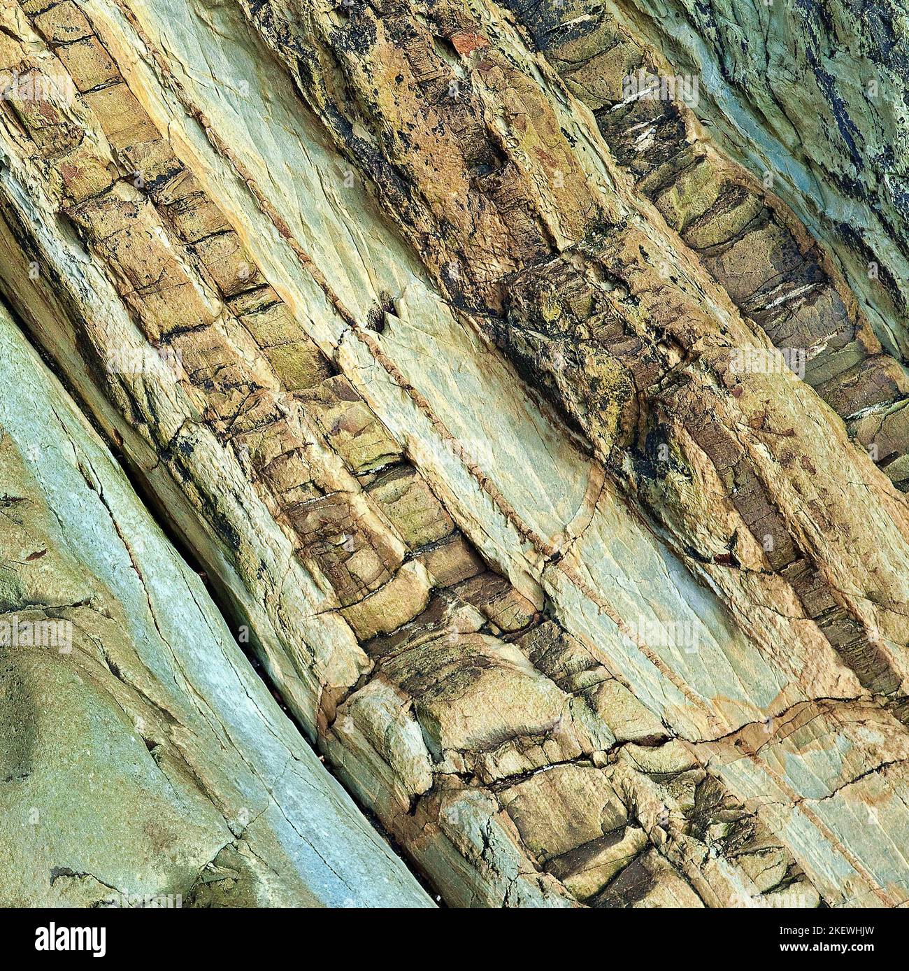 Rock and cliff faces with a varied geology at marloes sands beach ...