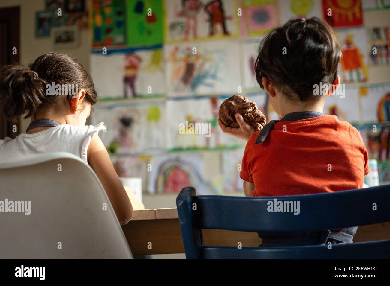 back view of two girls preparing food at home Stock Photo - Alamy