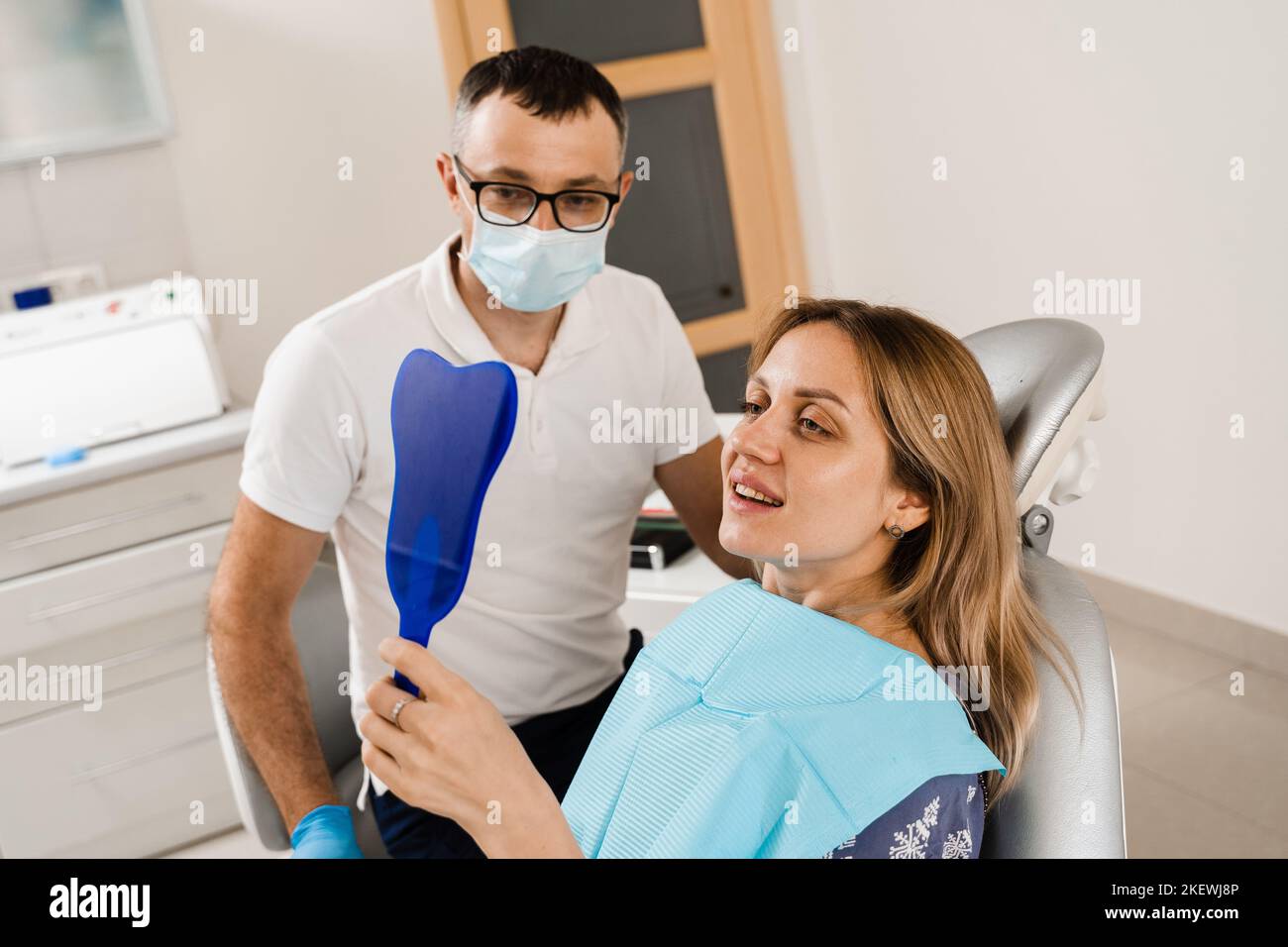 Consultation with dentist at dentistry. Teeth treatment. Woman looking ...
