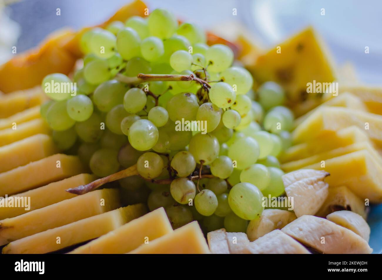 Grape, cheese and fruits. Healthy eating concept. Plate of ripe grape ...