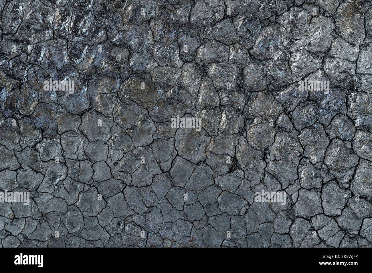 Black cracked texture of jet black surface of charcoal or soot close up ...