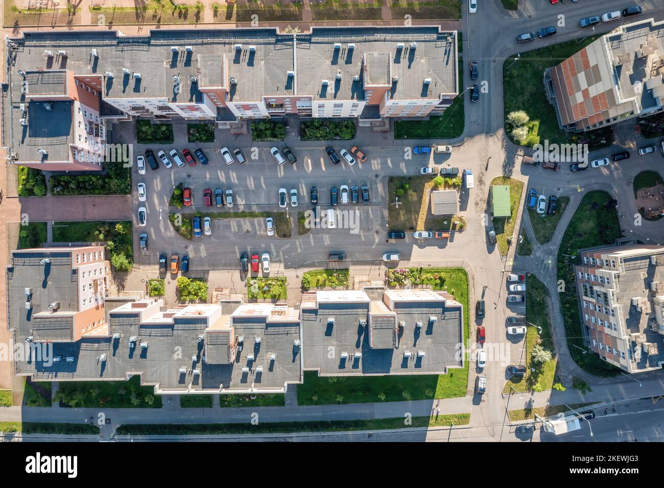 Chaotic parking in the courtyard of an apartment building top aerial ...