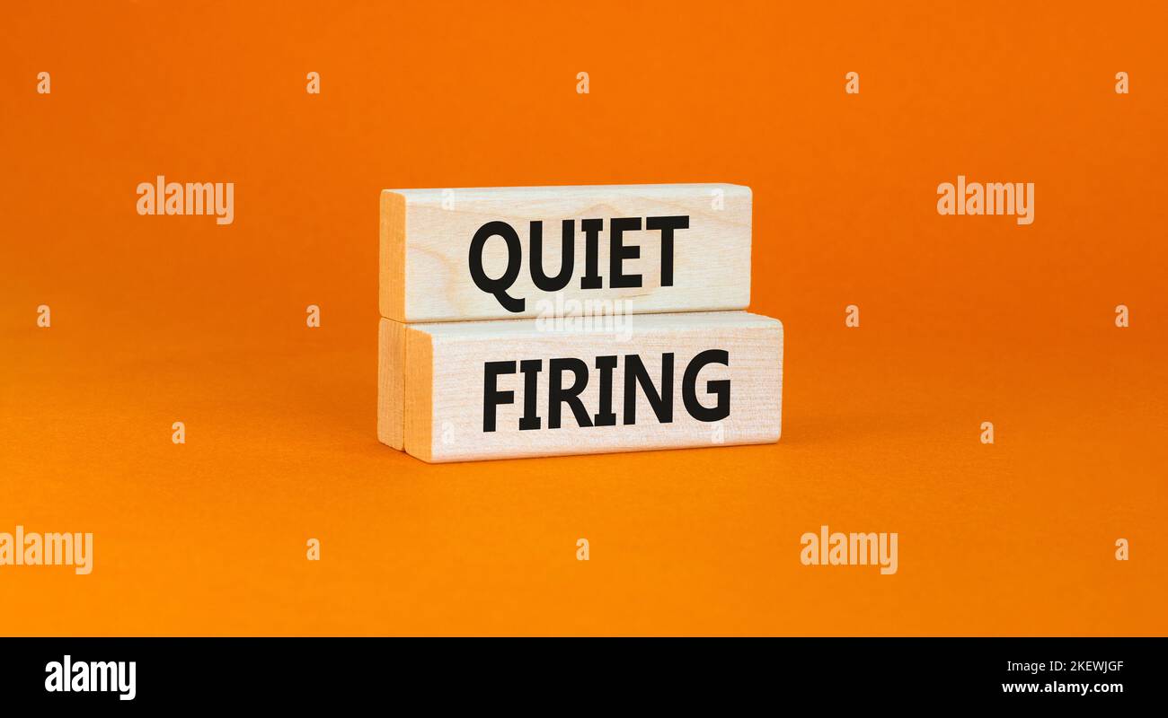 Quiet firing symbol. Concept words Quiet firing on wooden blocks ...