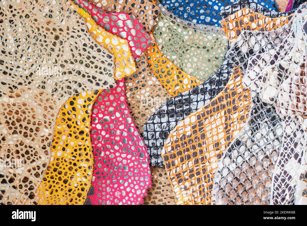 Colorful samples of fashion genuine leather, embossed under exotic skin ...