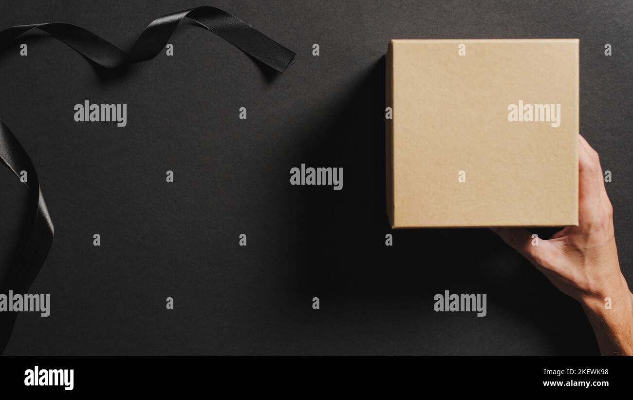 Holding cardboard box Stock Photo - Alamy