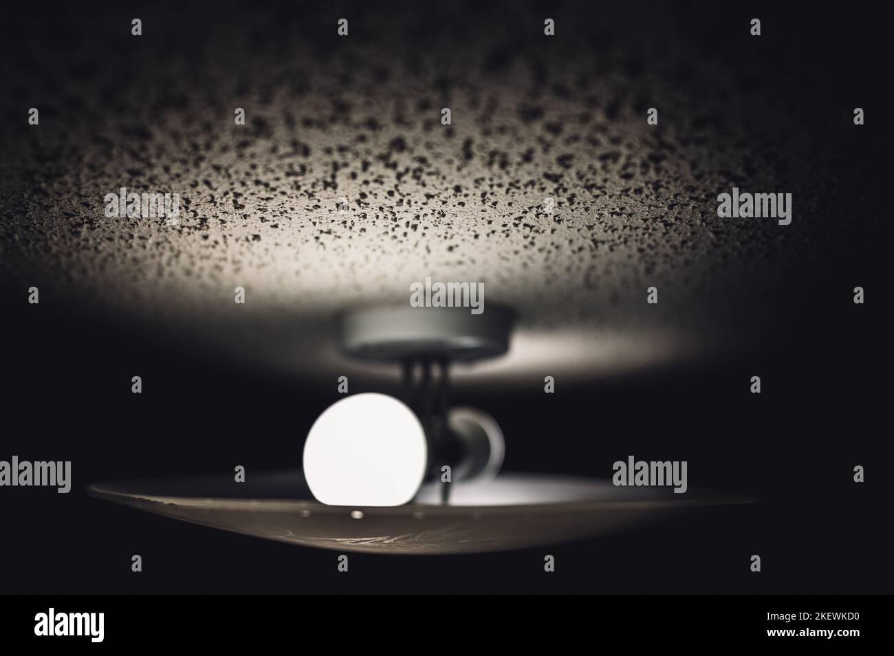 popcorn textured ceiling with LED bulb light fixture and glass cover ...