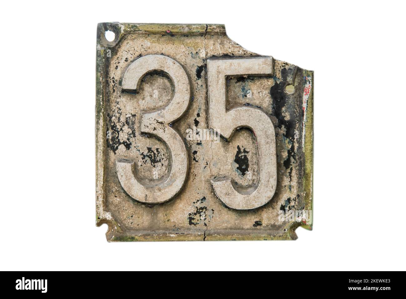 Old retro weathered cast iron plate with number 35 closeup isolated on ...