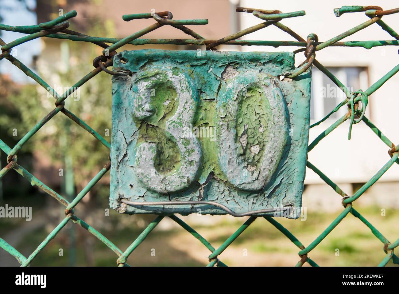 Old retro weathered cast iron plate number 30 closeup Stock Photo - Alamy