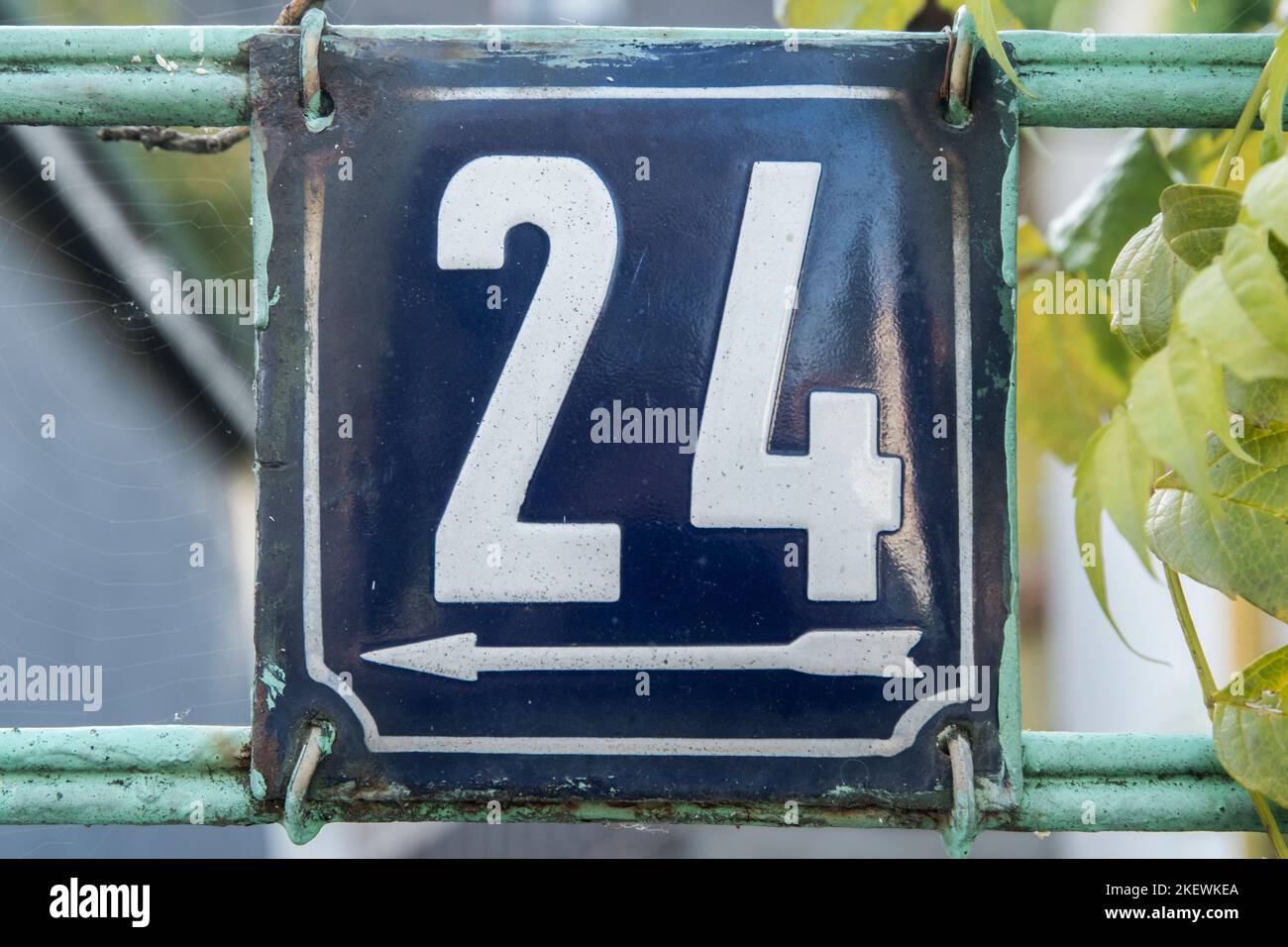Weathered grunge square metal enameled plate of number of street ...