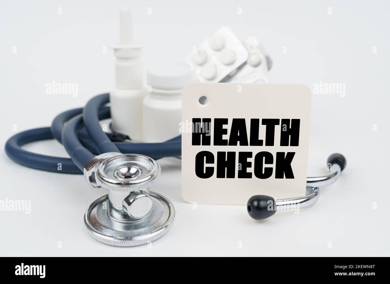 Medical concept. On a white surface, medicines, a stethoscope and ...