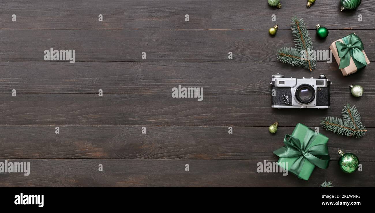 Festive composition with photo camera, gifts and Christmas decorations ...