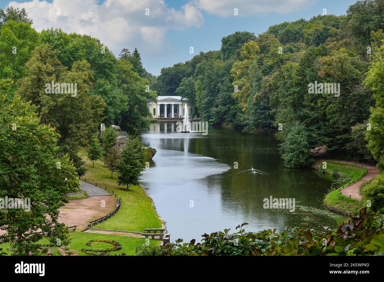 View of beautiful park with river, fountain and green trees Stock Photo ...