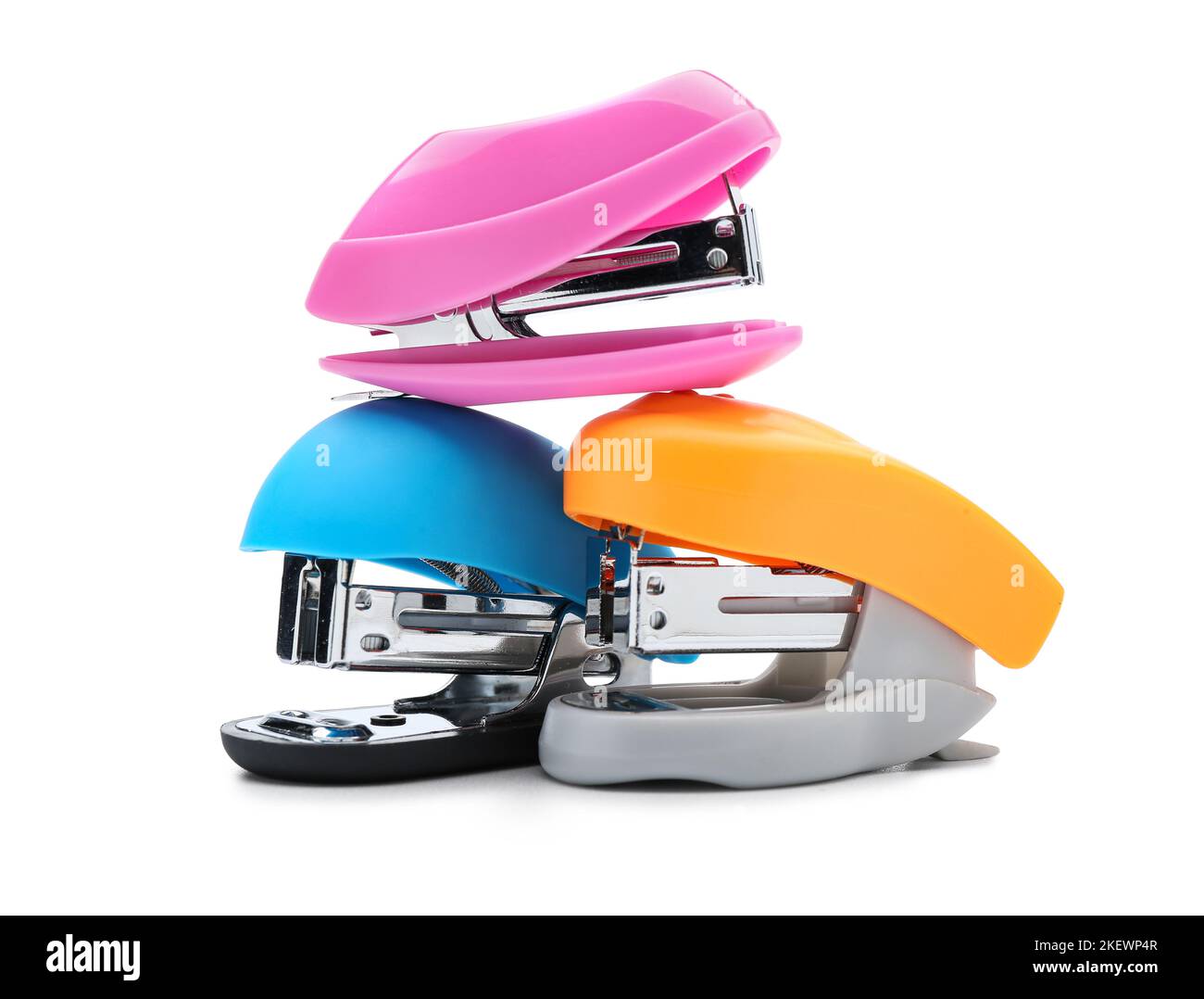 Colorful office staplers on white background Stock Photo - Alamy