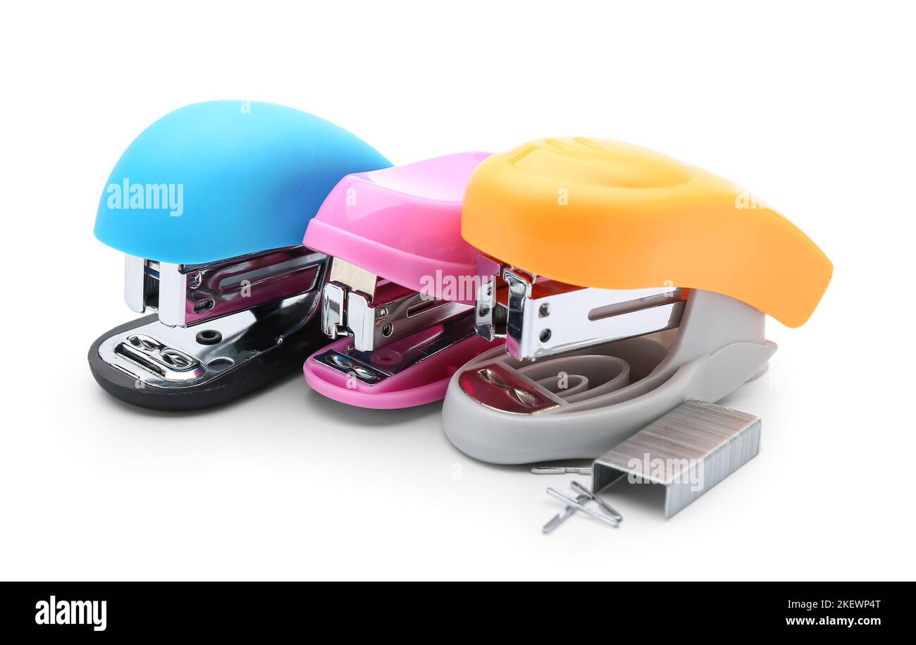 Colorful office staplers on white background Stock Photo - Alamy