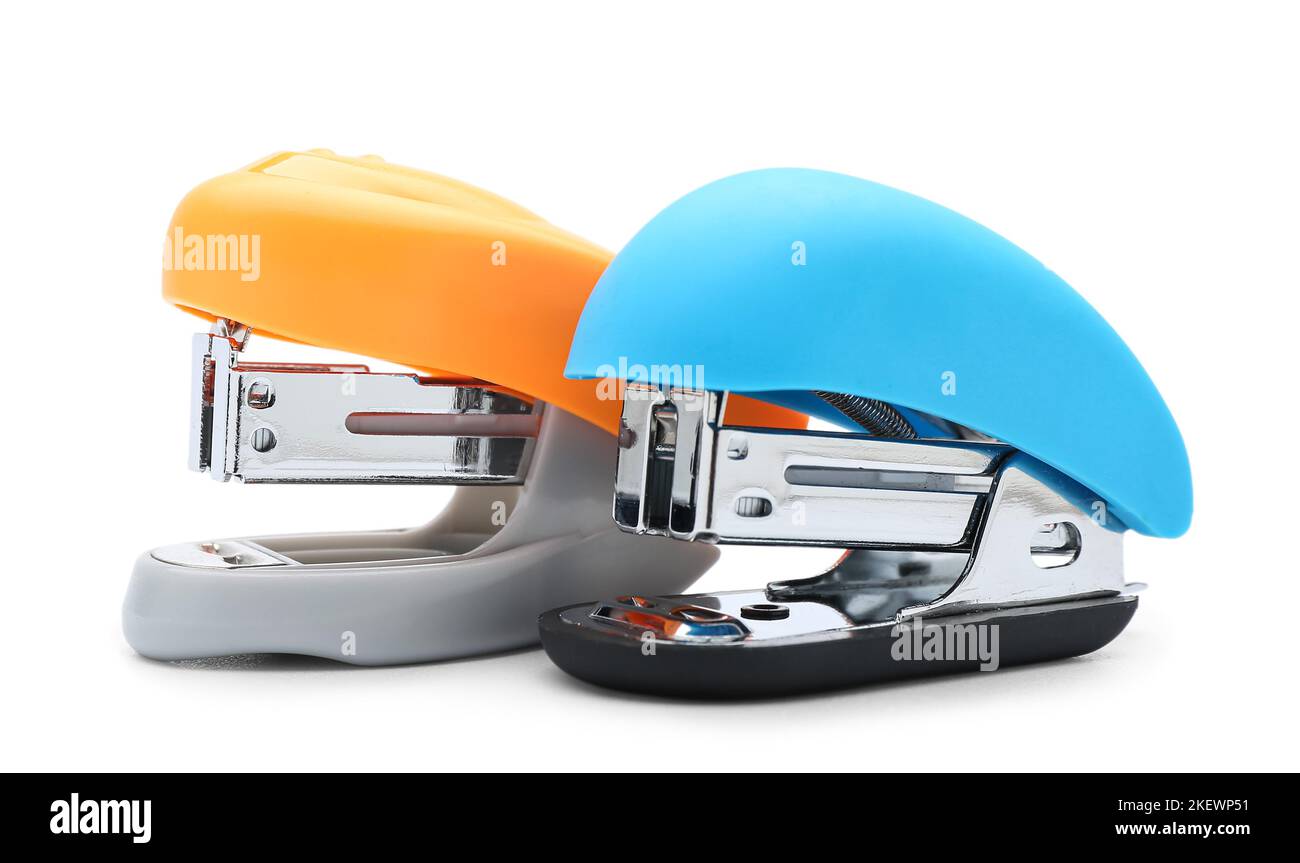Two colorful office staplers on white background Stock Photo - Alamy