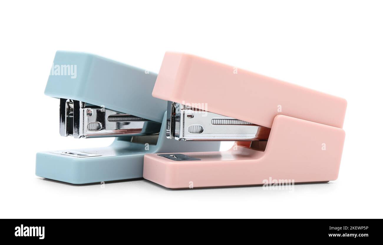 Colorful staplers isolated on white background Stock Photo - Alamy