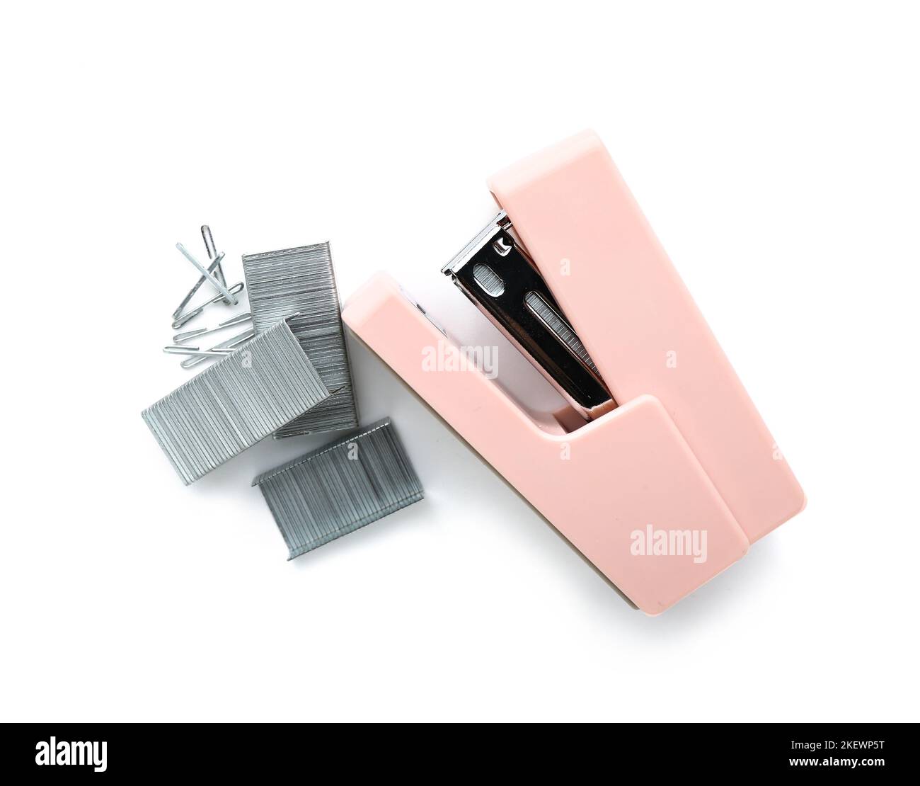 Pink stapler with staples isolated on white background Stock Photo - Alamy
