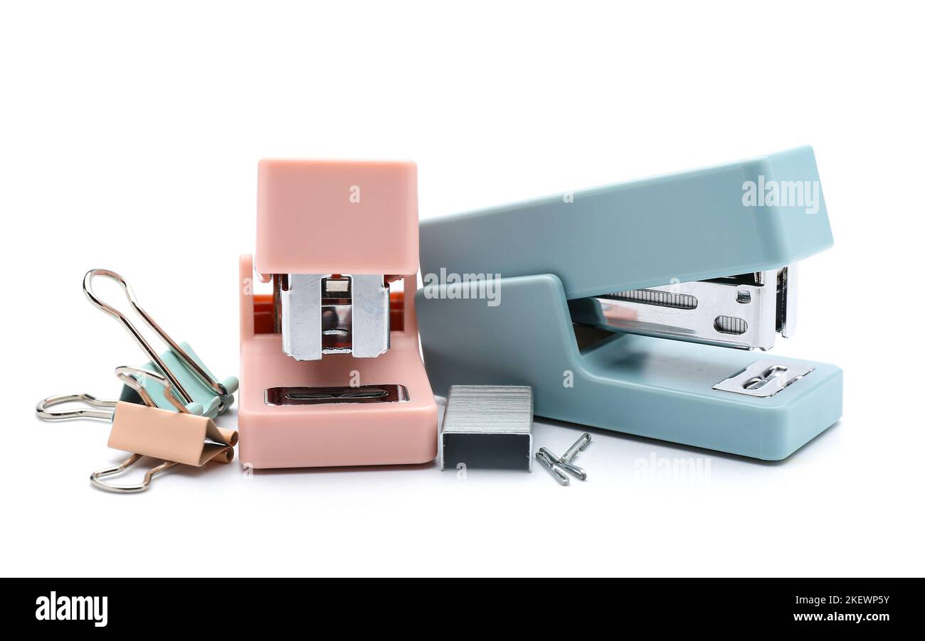Office staplers, staples and paper clips on white background Stock ...