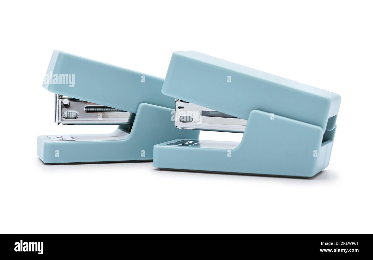 Blue staplers isolated on white background Stock Photo - Alamy