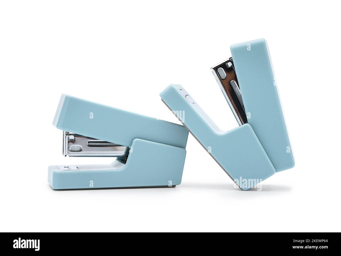 Blue staplers isolated on white background Stock Photo - Alamy