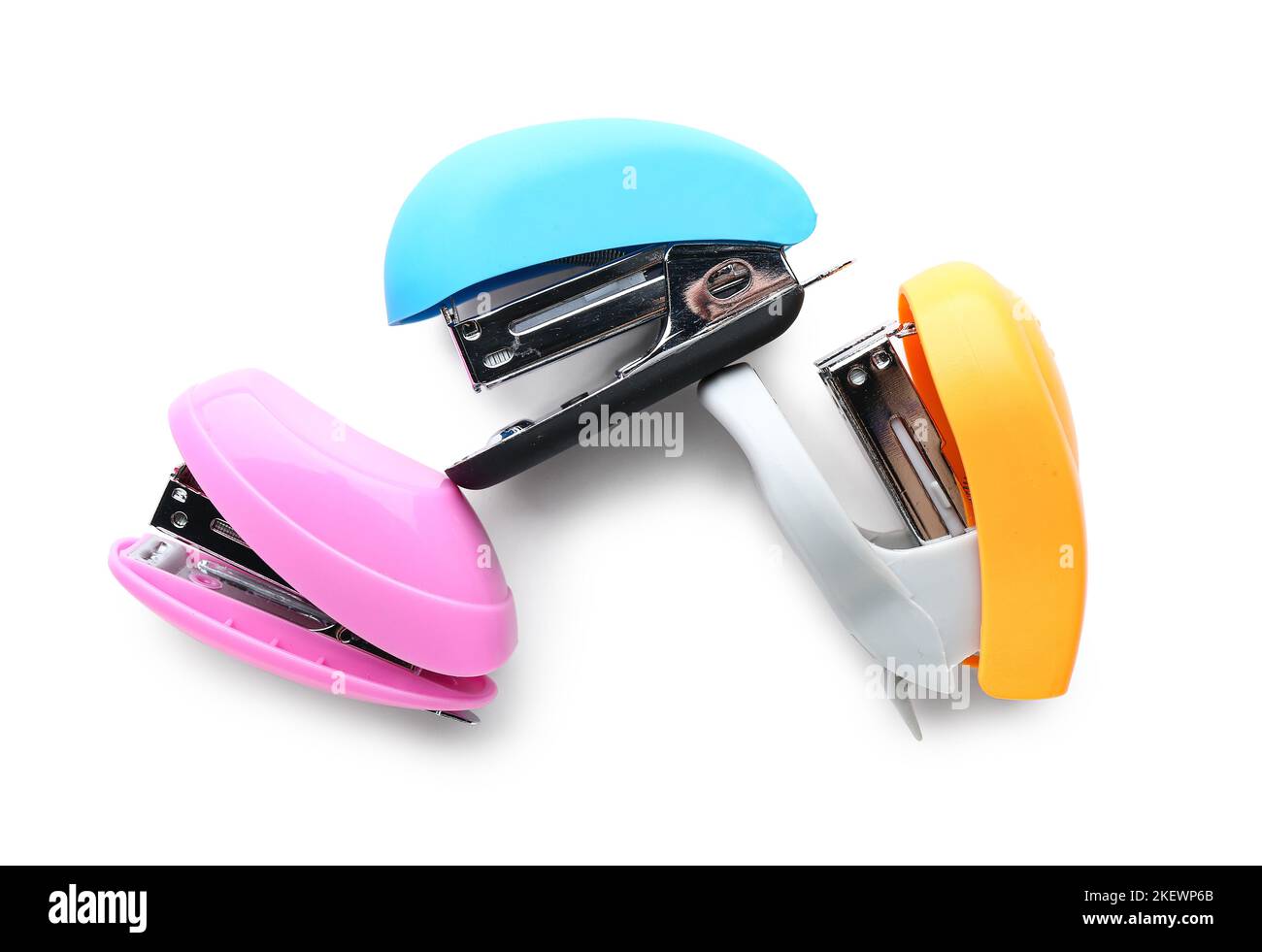Three colorful staplers isolated on white background Stock Photo - Alamy
