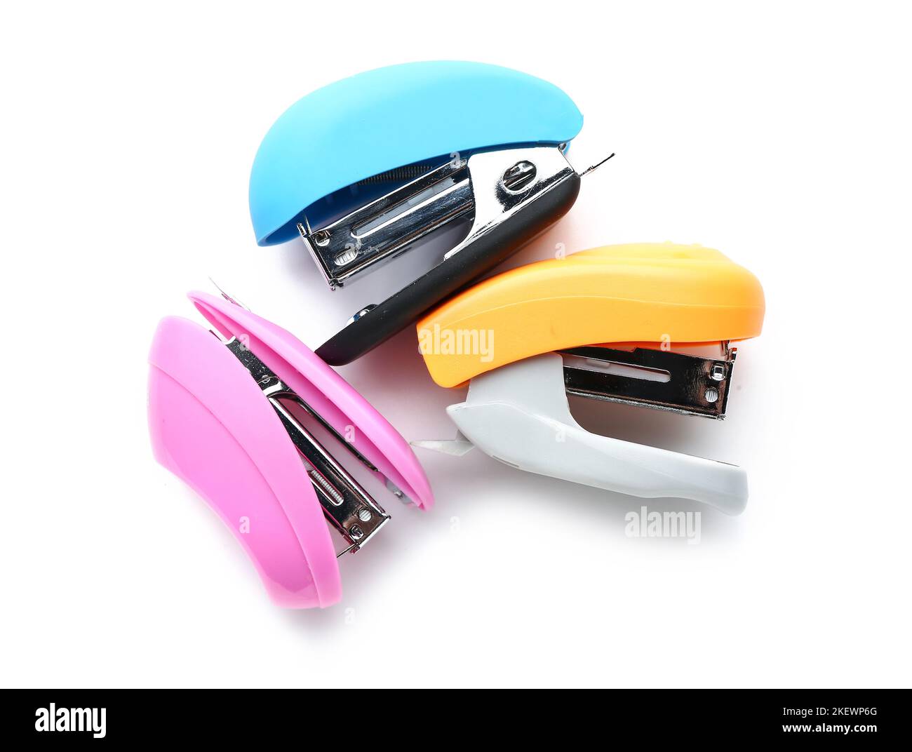 Three colorful staplers isolated on white background Stock Photo - Alamy