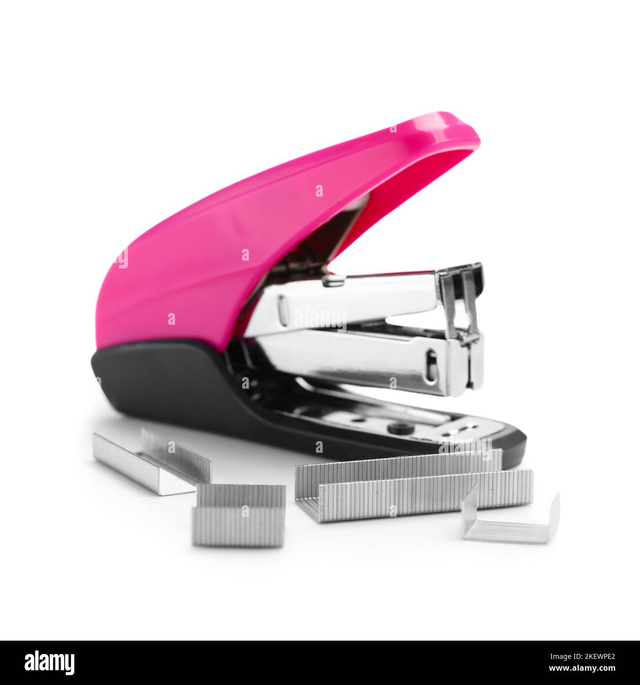 Pink office stapler with staples on white background Stock Photo - Alamy