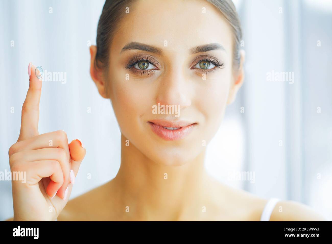 Health. Happy Woman with Contact Lenses on the Finger. Eye Care Stock ...
