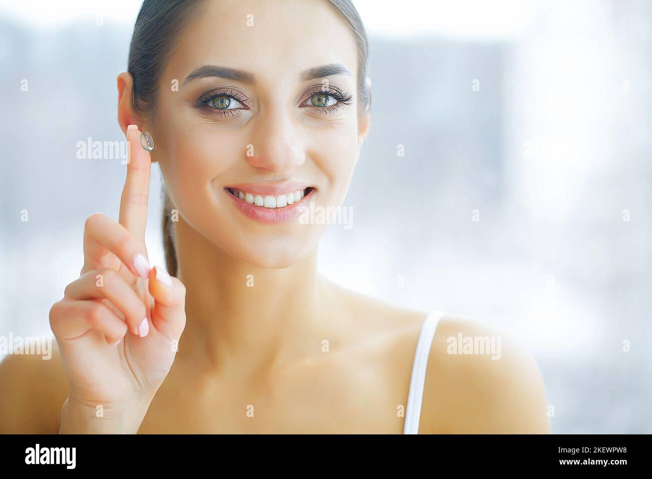 Health. Happy Woman with Contact Lenses on the Finger. Eye Care Stock ...
